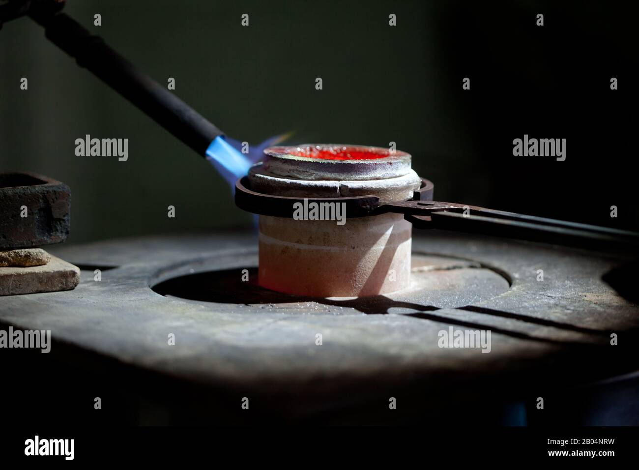 burning hot glowing cast mold for melting metal in metallurgical ...