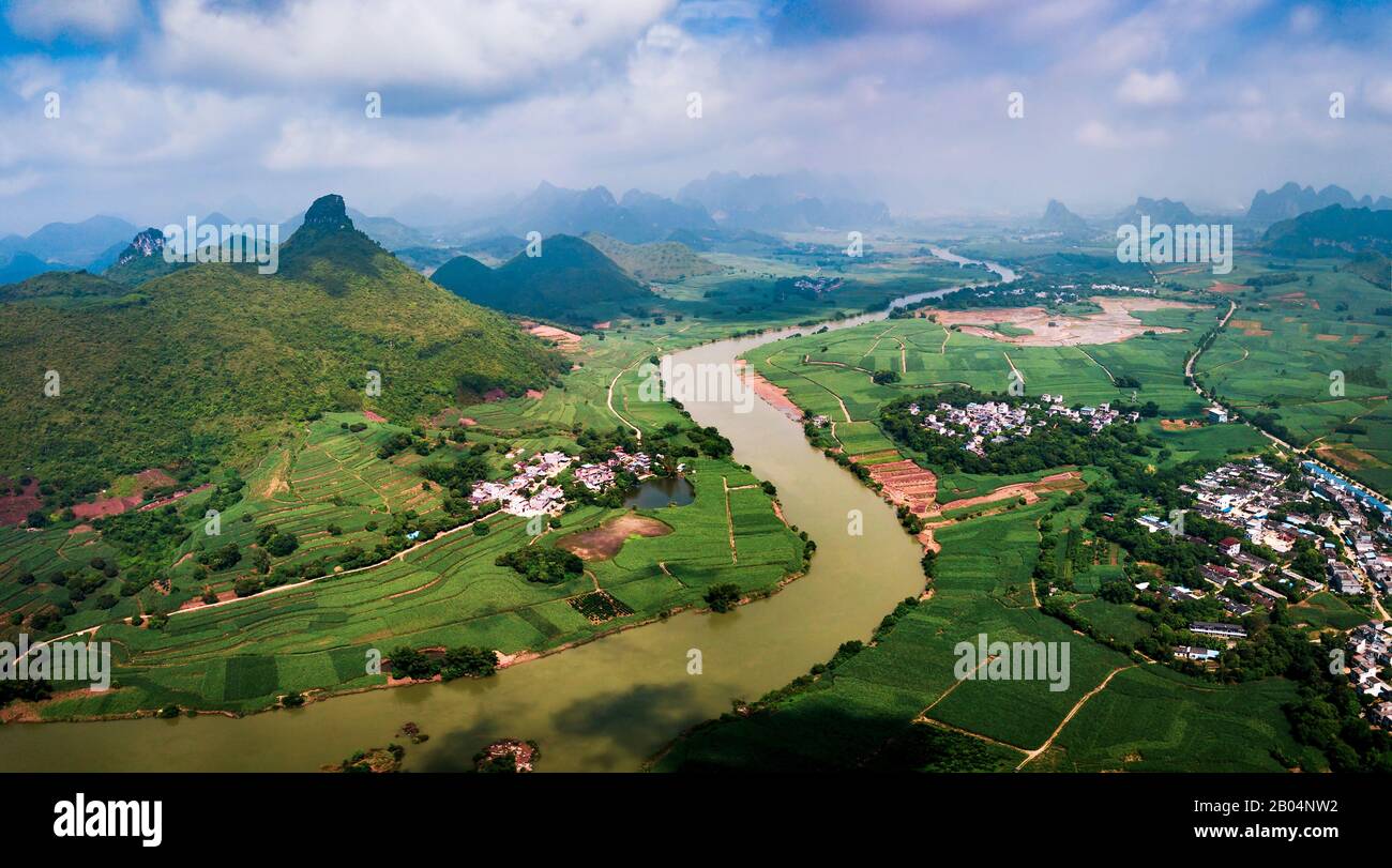 Rural Chinese landscape of limestone rocks and rice fields in Guangxi ...