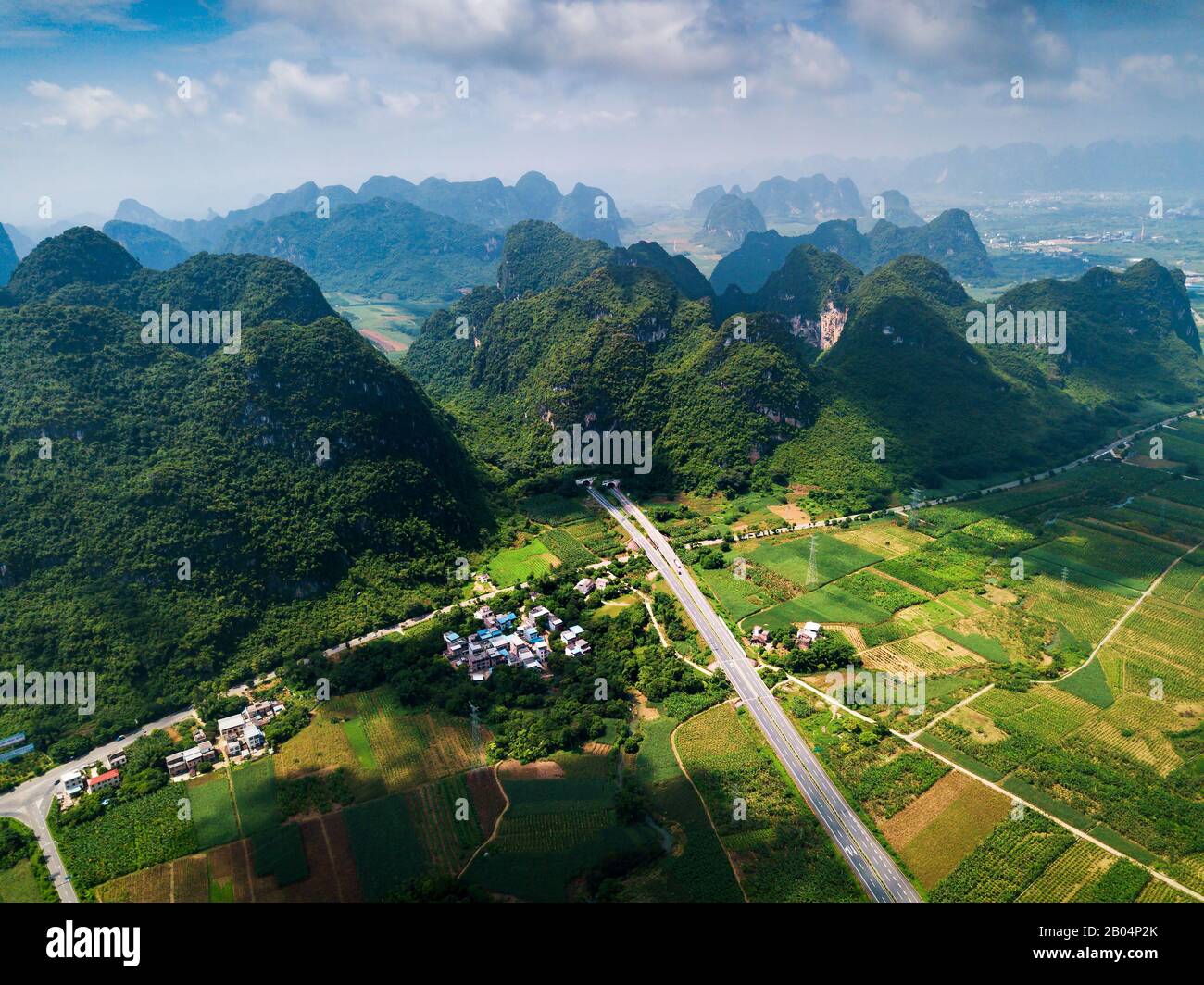 Scenic highway in Guangxi province of China surrounded with rice fields ...