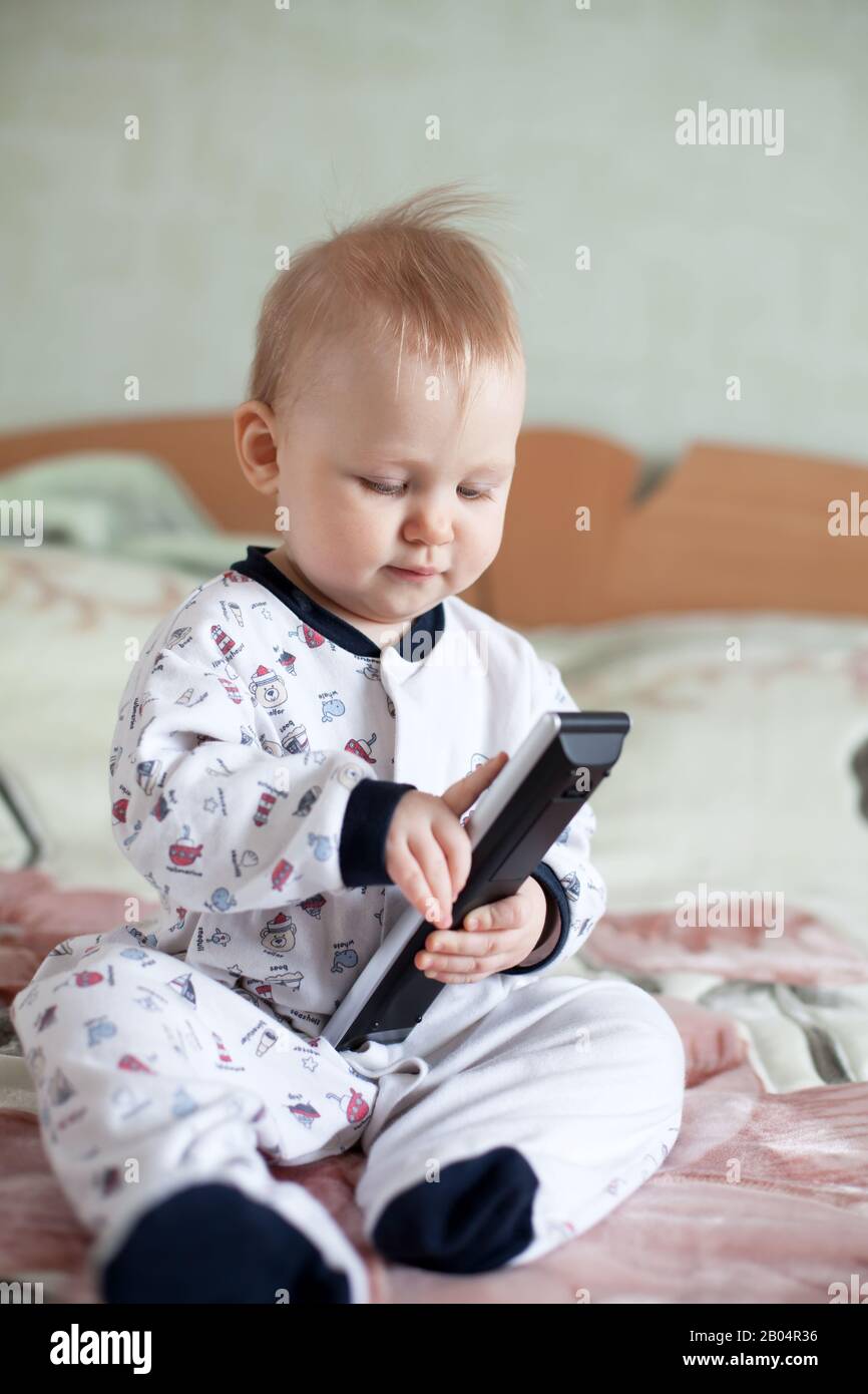 Baby with remote control hi-res stock photography and images - Alamy