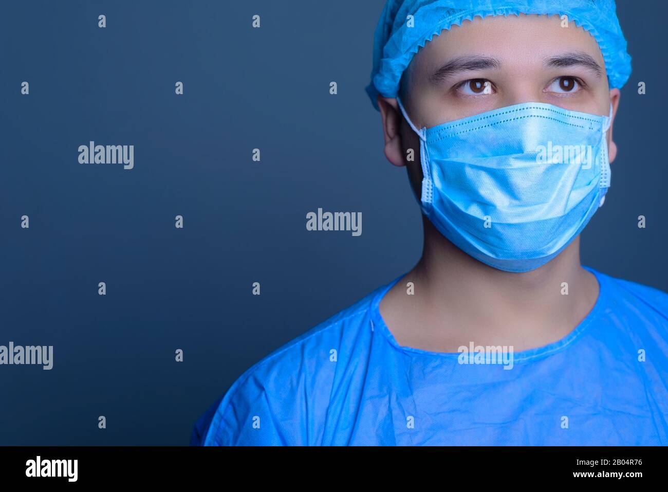 close-up portrait of a caucasian doctor surgeon, in a sterile suit ...
