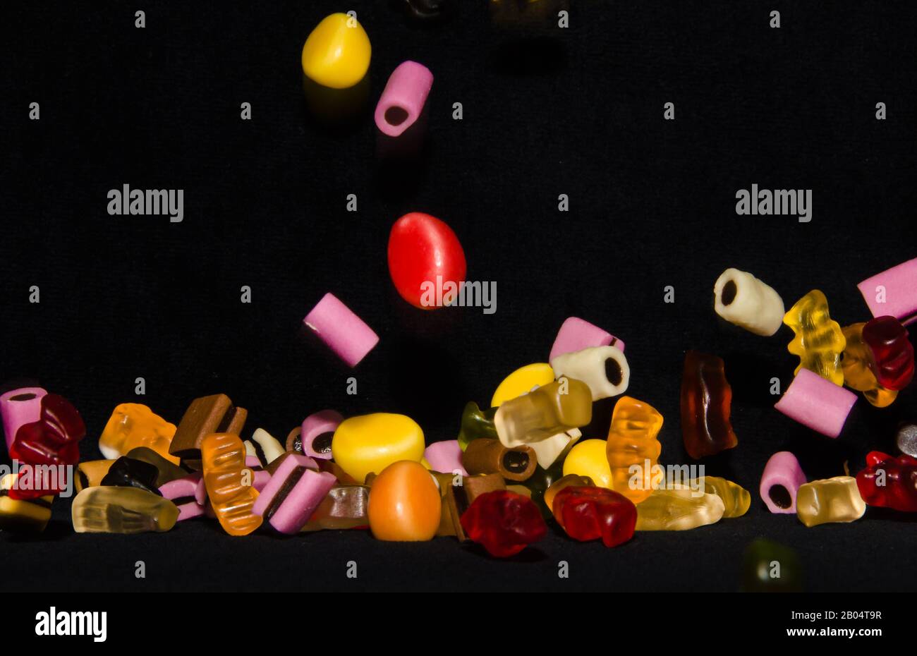 Candies falling down hi-res stock photography and images - Alamy