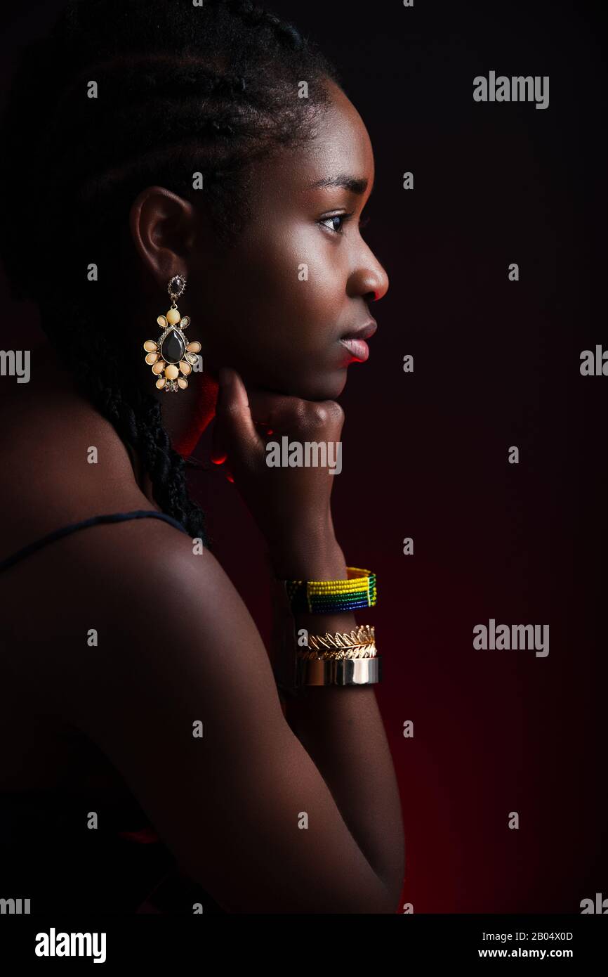 Colorful and dark side view portrait of native african woman Stock ...