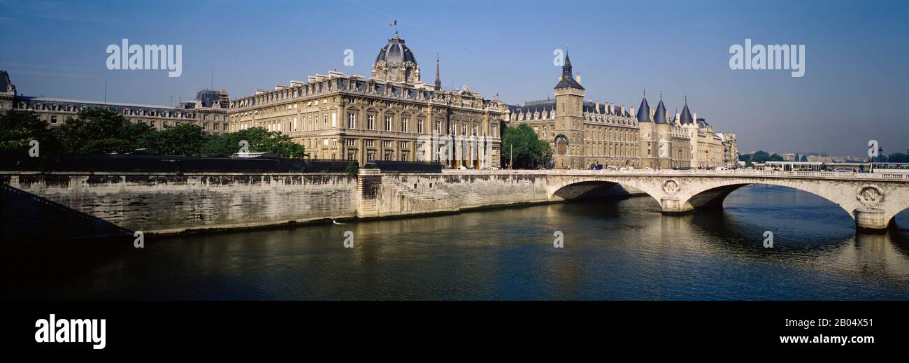 Arch bridge across a river, Palais De Justice, Seine River, Paris ...