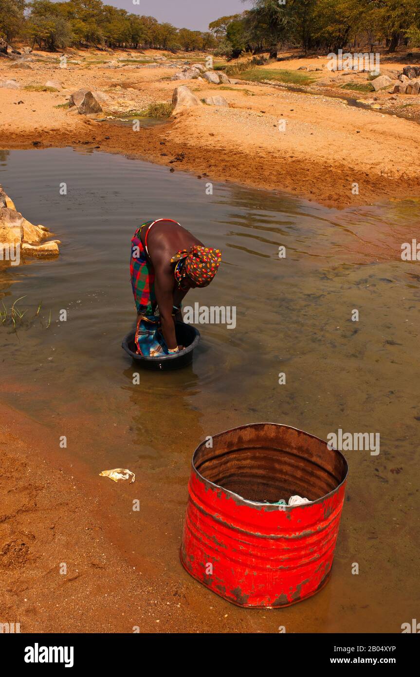 Woman Washing Clothes On The River High Resolution Stock Photography ...