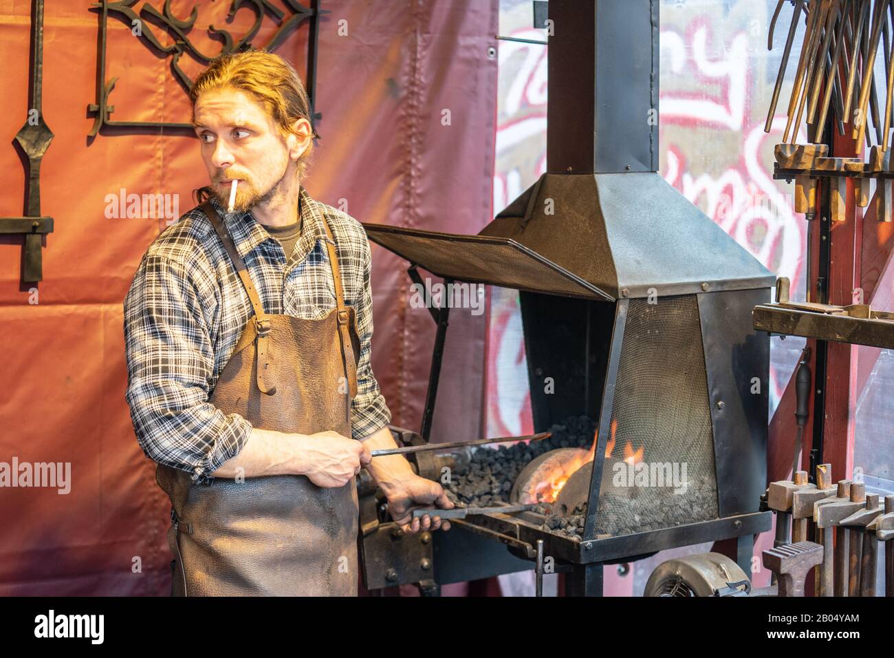 Male blacksmith working in workshop, London. Concept Stock Photo - Alamy