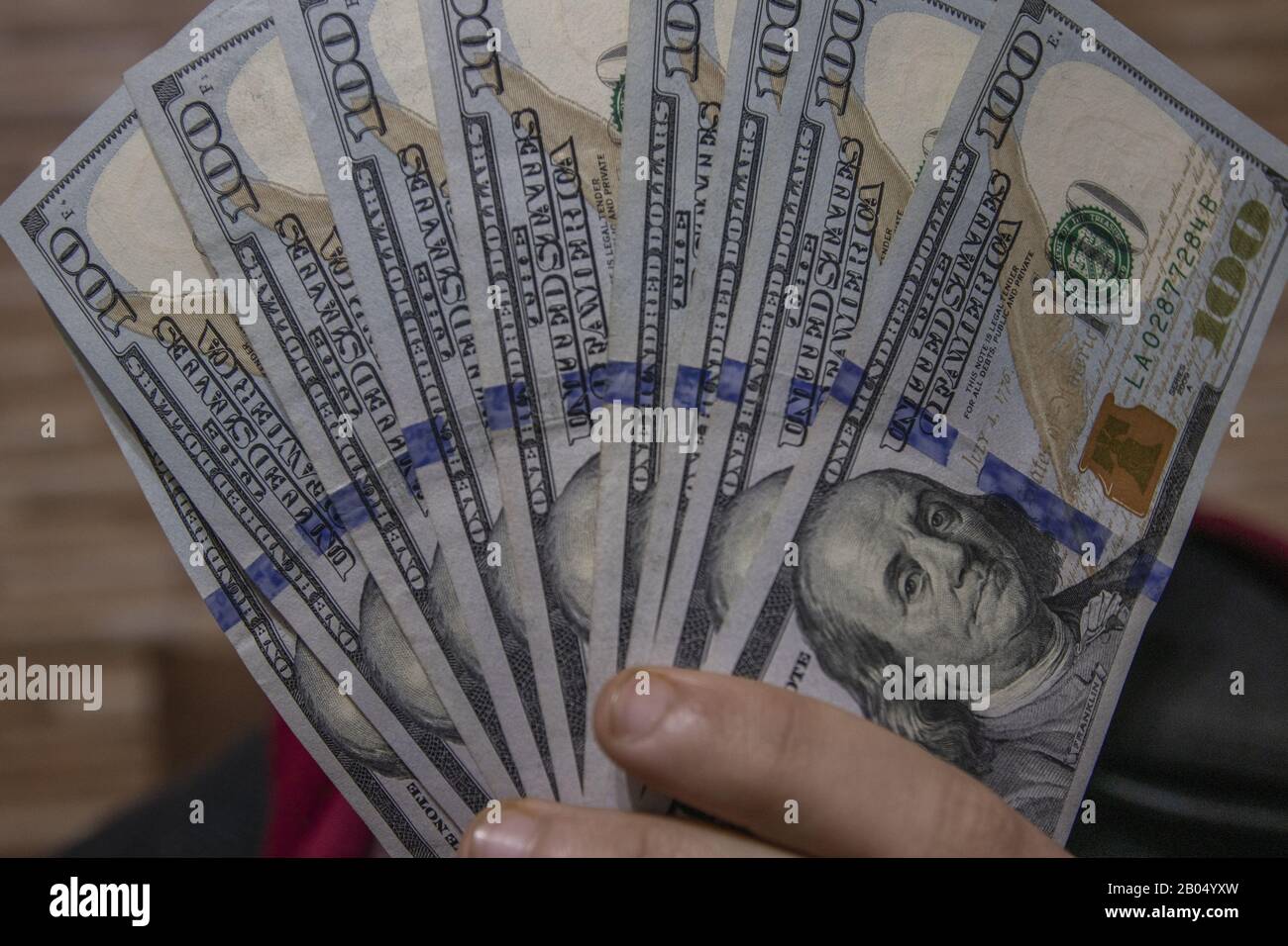 Counting finance banknote standing holding hi-res stock photography and ...