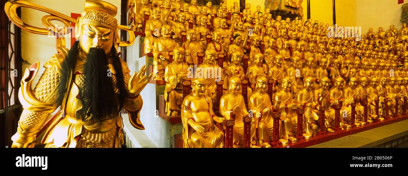 Golden statues in a temple, Longhua Temple, Shanghai, China Stock Photo ...