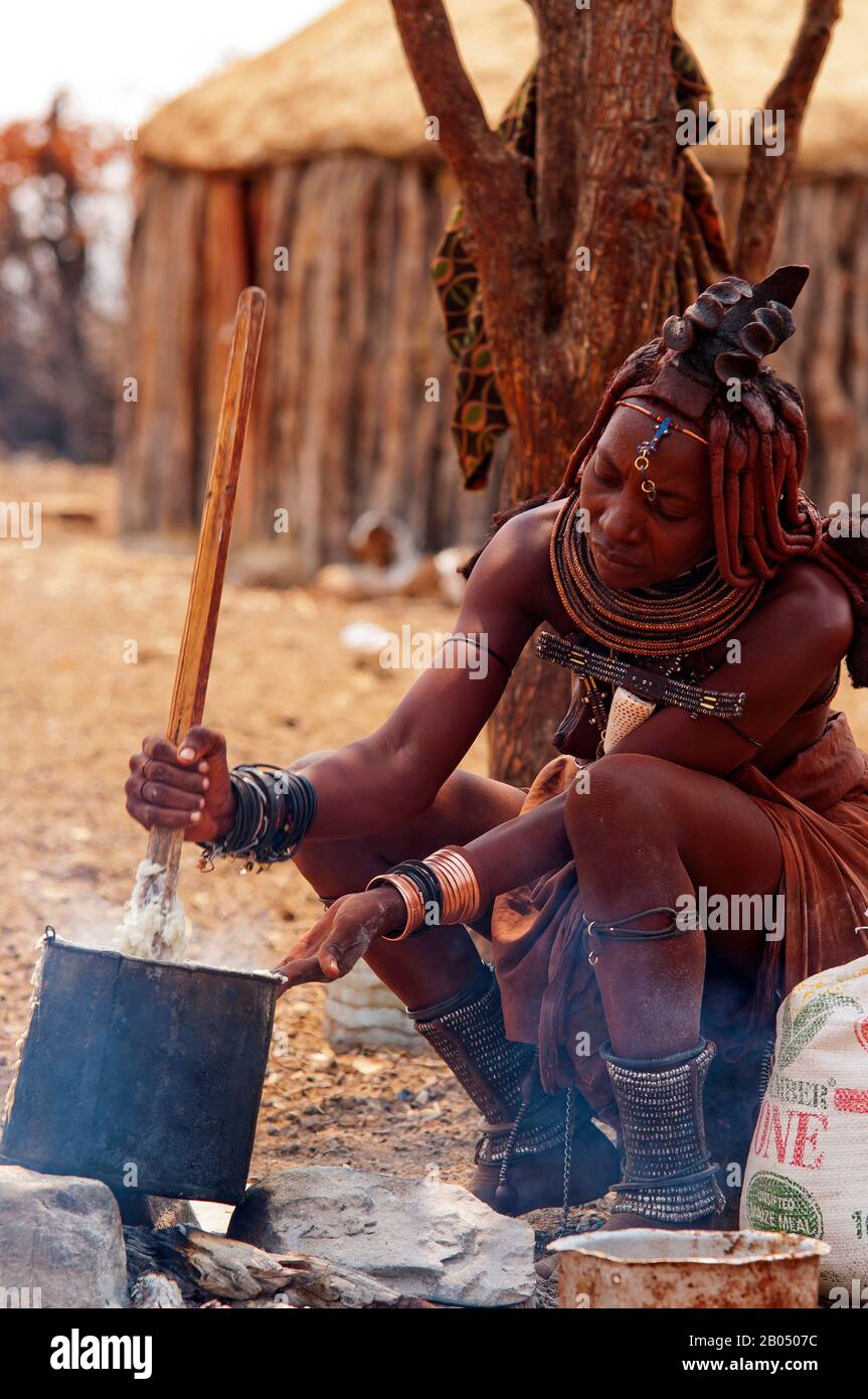 Himba woman cooking hi-res stock photography and images - Alamy