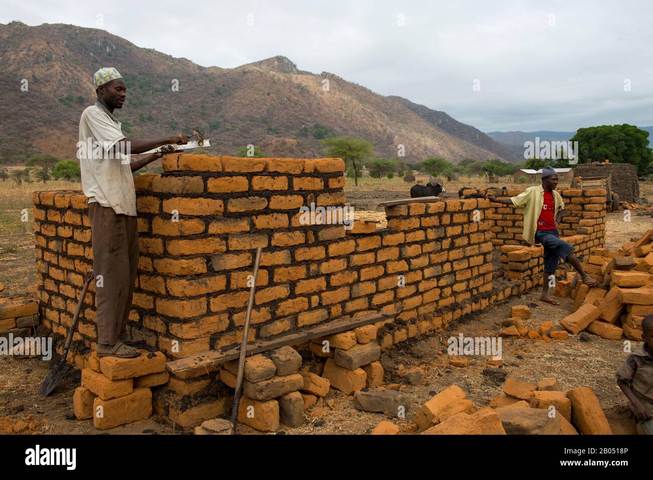 People building a small house out of bricks near Lake Manyara in ...