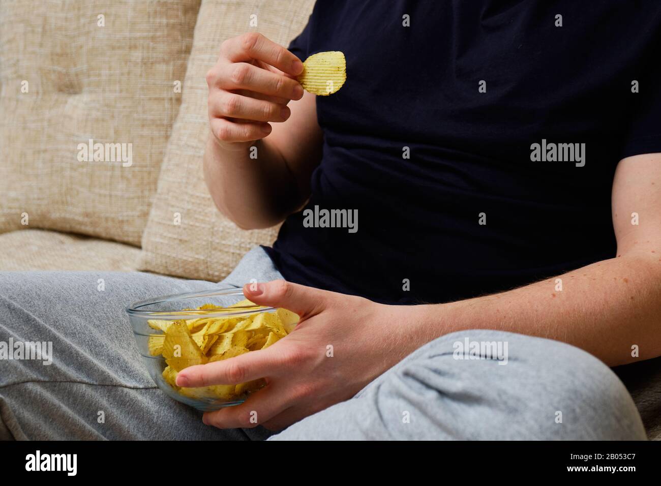 Man eating chips close up hi-res stock photography and images - Alamy