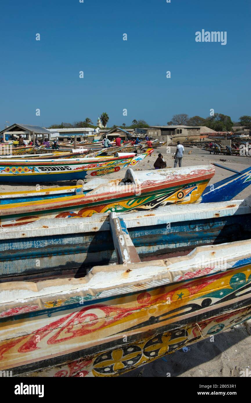 Colorful fishing boats on beach at Soumbedioune, one of the many ...