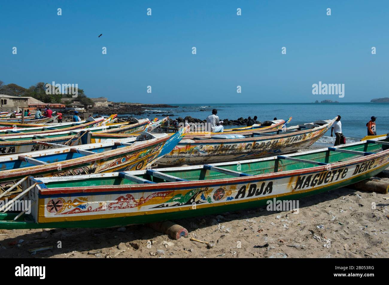 Colorful fishing boats on beach at Soumbedioune, one of the many ...