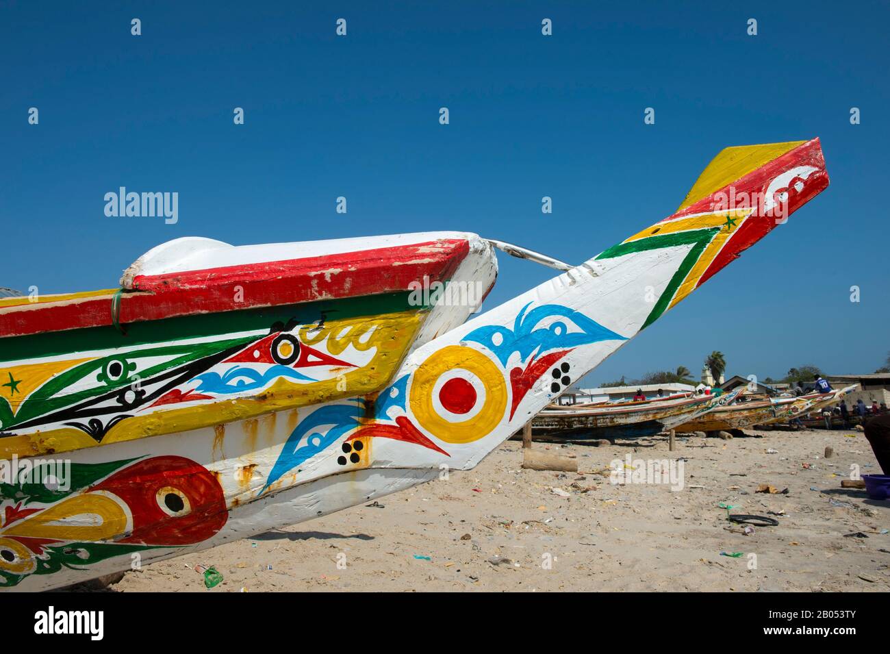 Colorful fishing boats on beach at Soumbedioune, one of the many ...