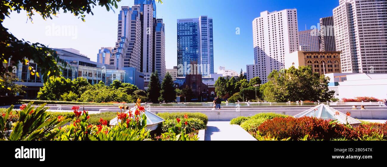 Formal garden in front of skyscrapers, Yerba Buena Gardens, South of ...