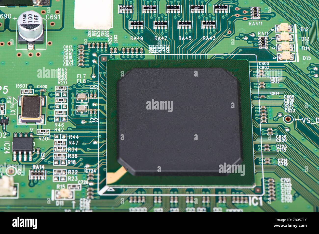 A microprocessor soldered into a green motherboard. The world of ...