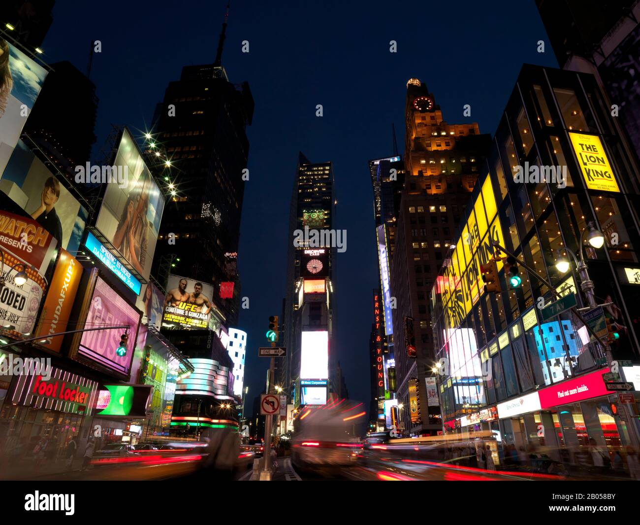Buildings in a city lit up at dusk, Times Square, Manhattan, New York ...