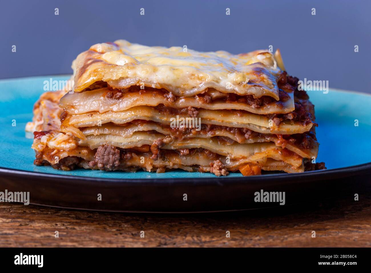 Fresh lasagne on blue hi-res stock photography and images - Alamy