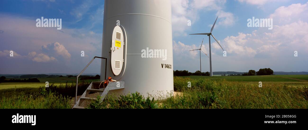 Wind turbine in a field with open door for maintenance, Baden ...