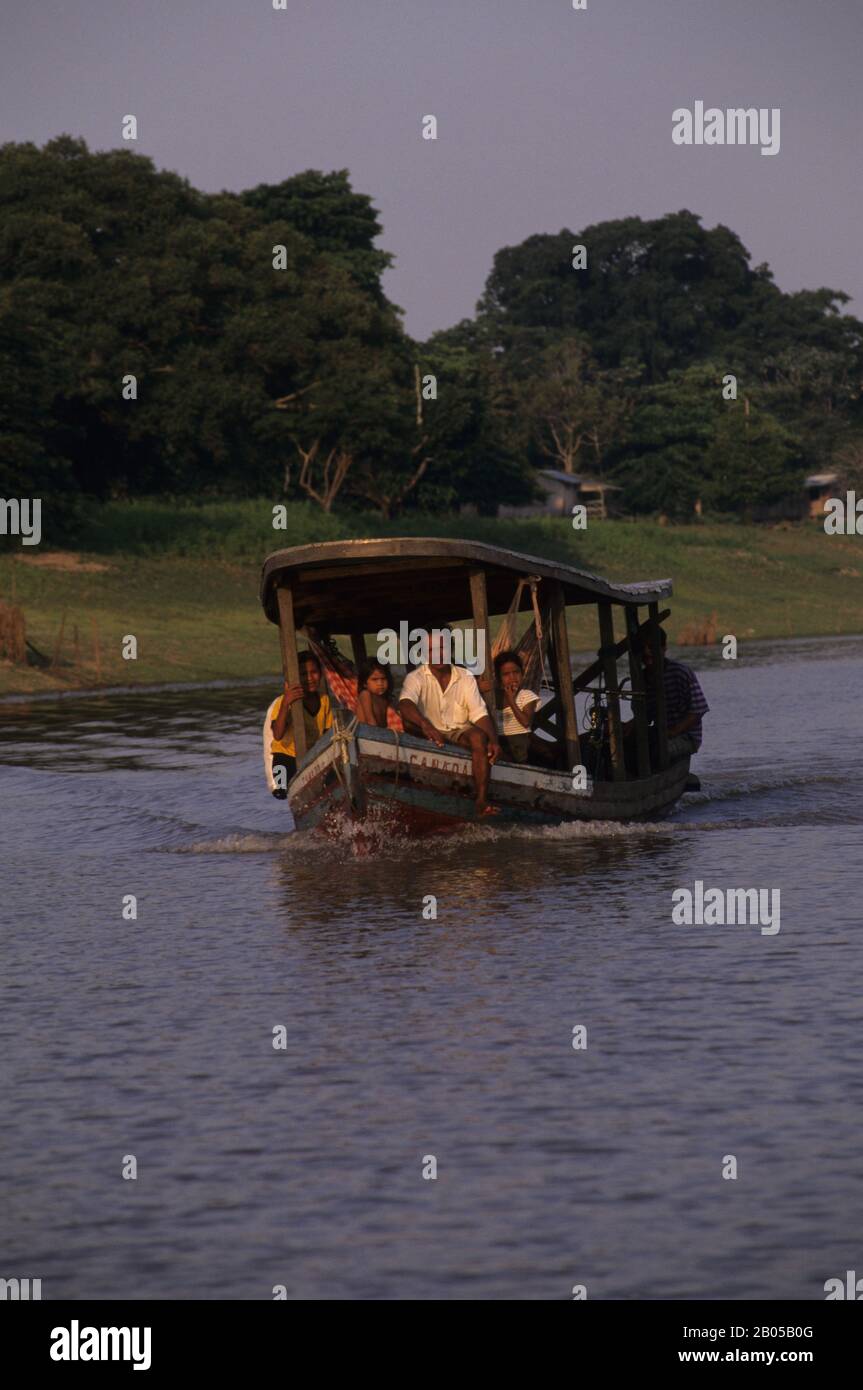 BRAZIL, AMAZON RIVER, RIO BALAIO, LOCAL PEOPLE (CABOCOLOS) IN BOAT ...