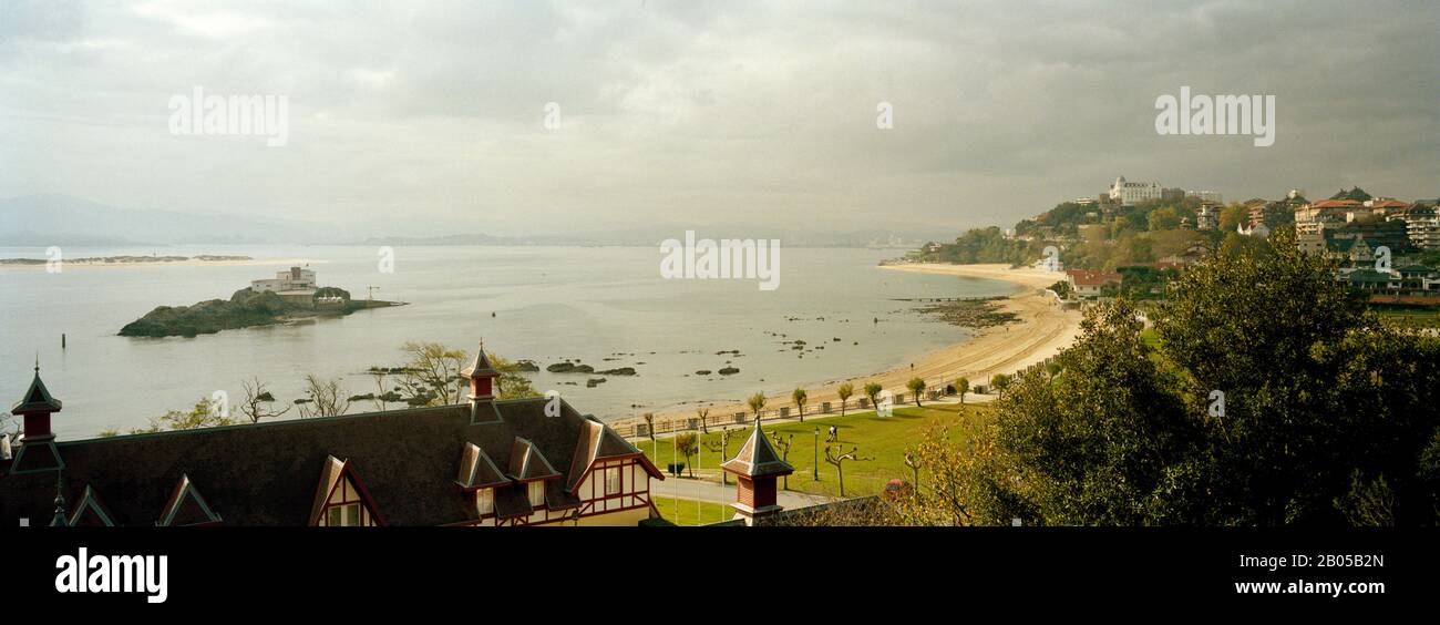 Trees along a coast, Santander Bay, Santander, Cantabria, Spain Stock ...