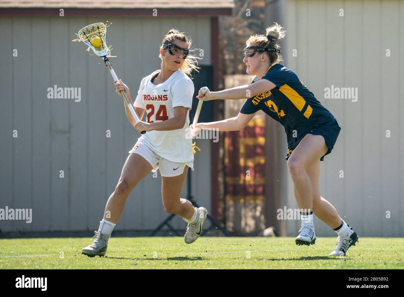 Southern California Trojans attacker Sarah Larkin (24) looks to get ...