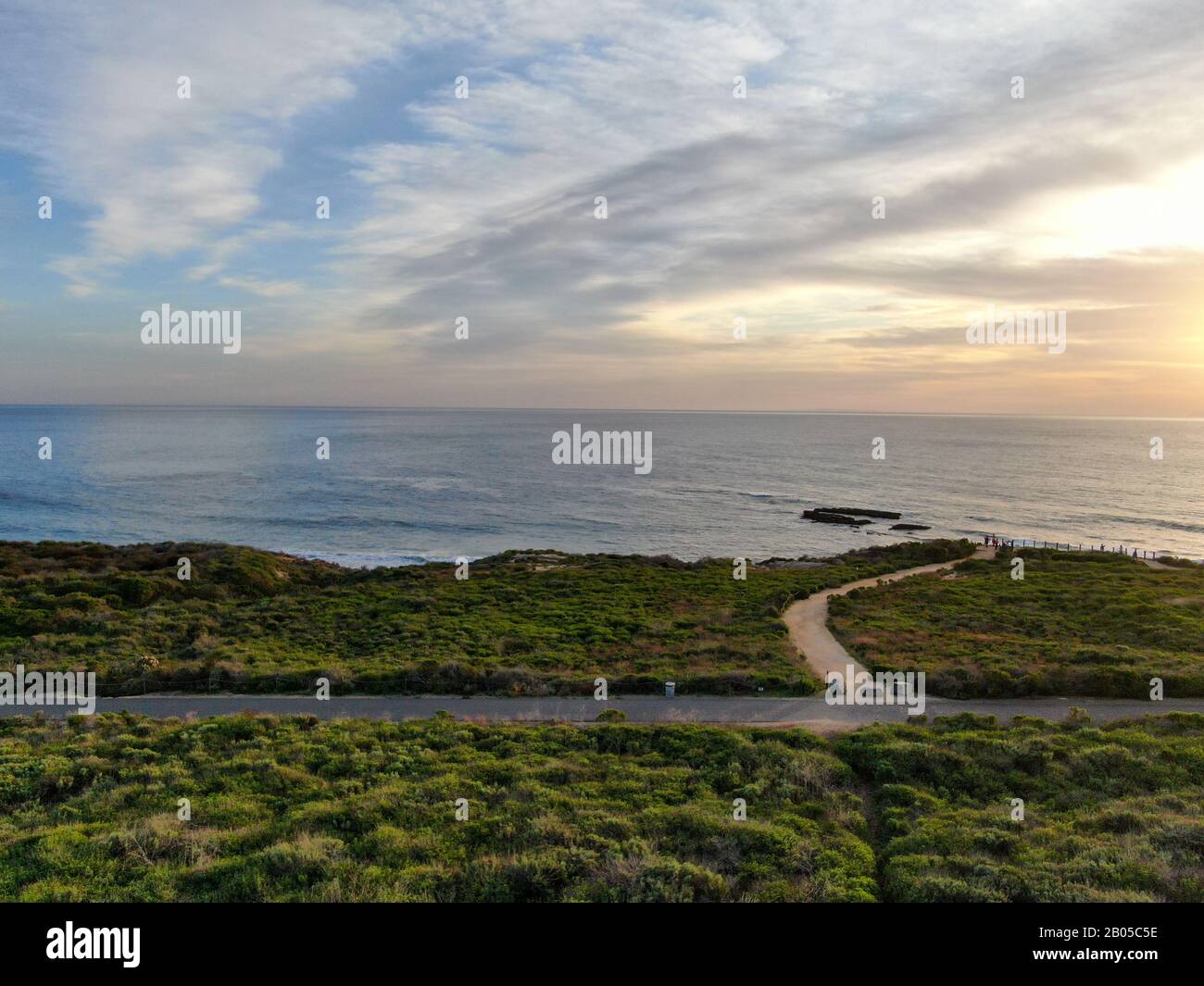 Aerial view of Pacific ocean colorful sunset, facing the sun with ...