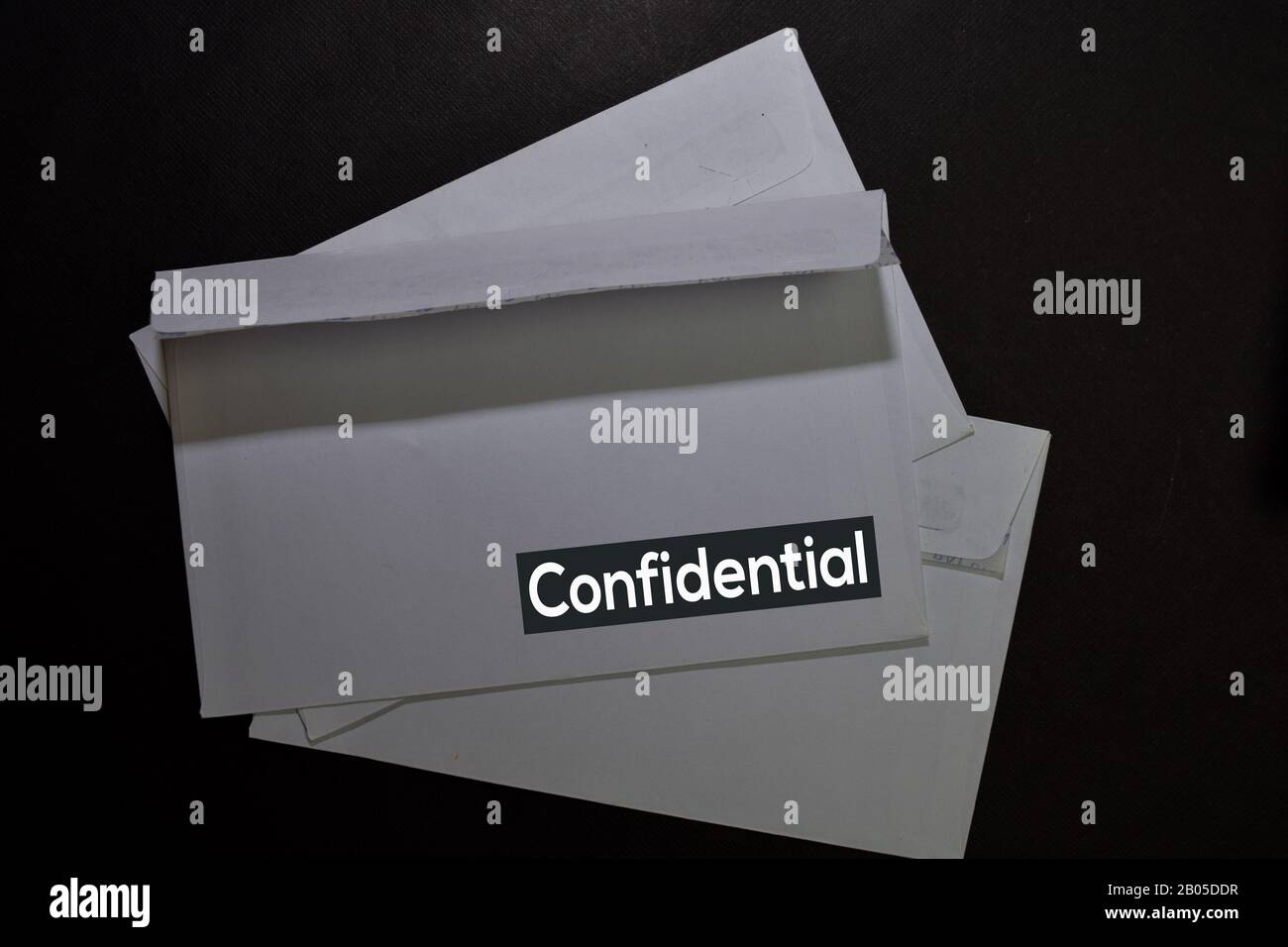 Confidential Write On A White Envelope Isolated On Office Desk Stock Confidential Write On A White Envelope Isolated On Office Desk Stock