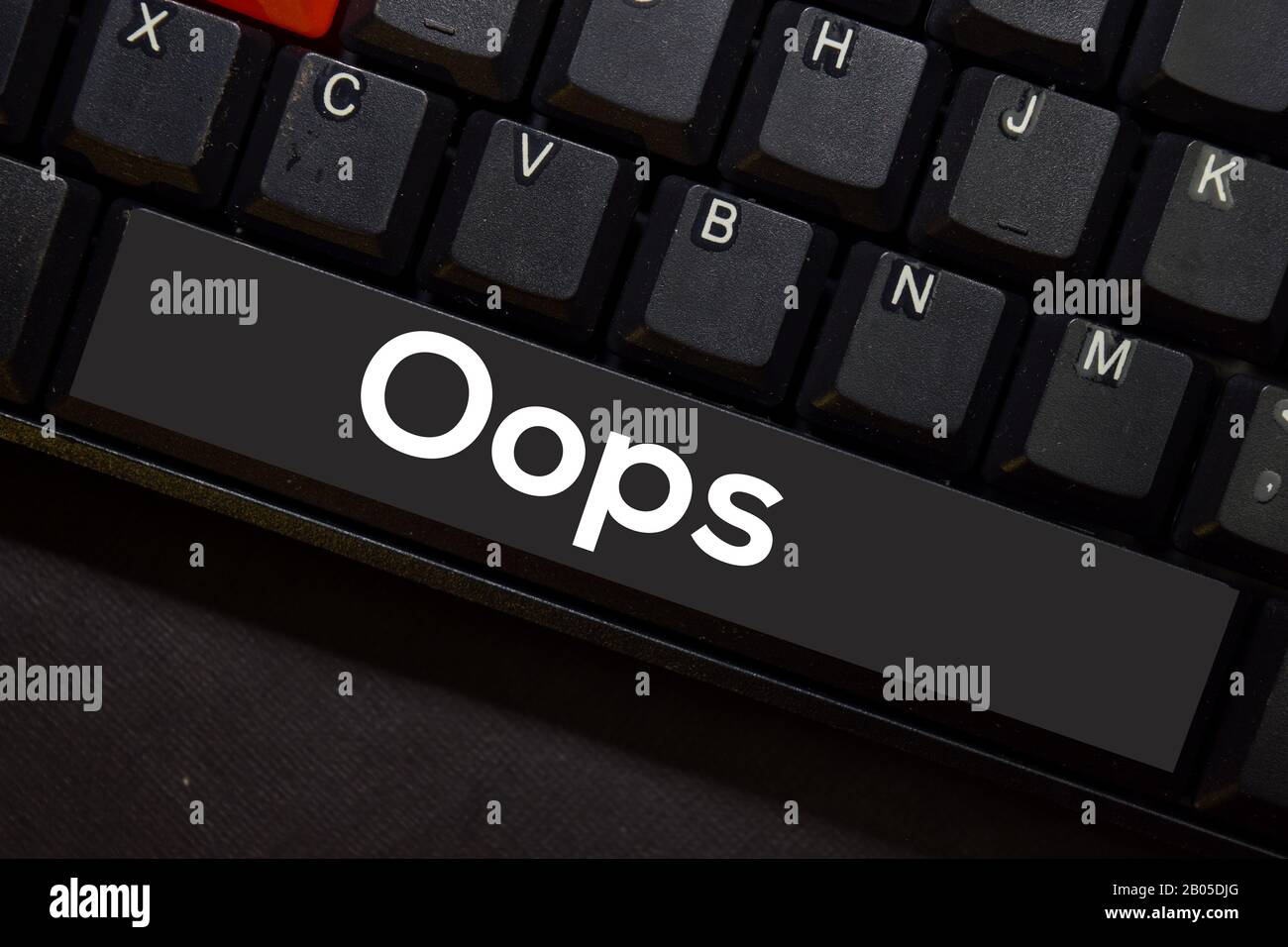 Oops isolated on laptop keyboard background Stock Photo - Alamy
