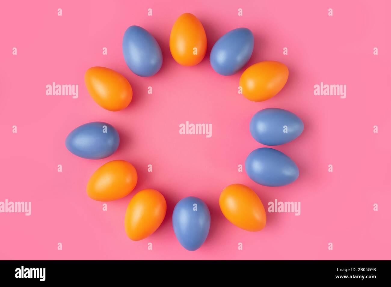 Top view of colorful Easter eggs on bright pink background Stock Photo ...