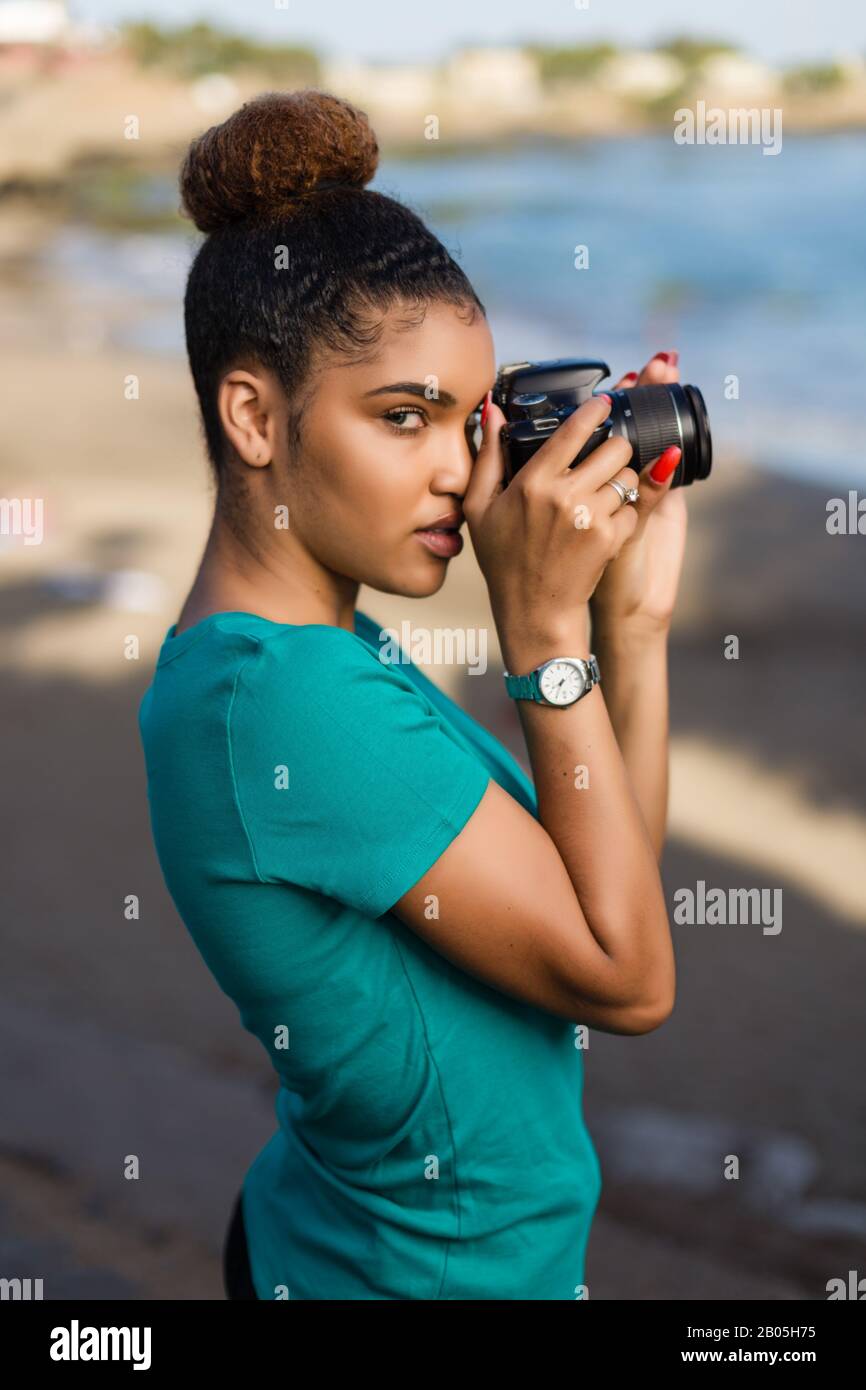 African American woman photographer taking outdoor photos - Black ...
