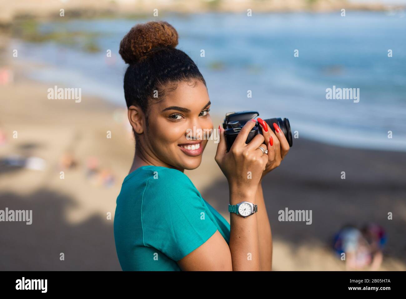 African American woman photographer taking outdoor photos - Black ...