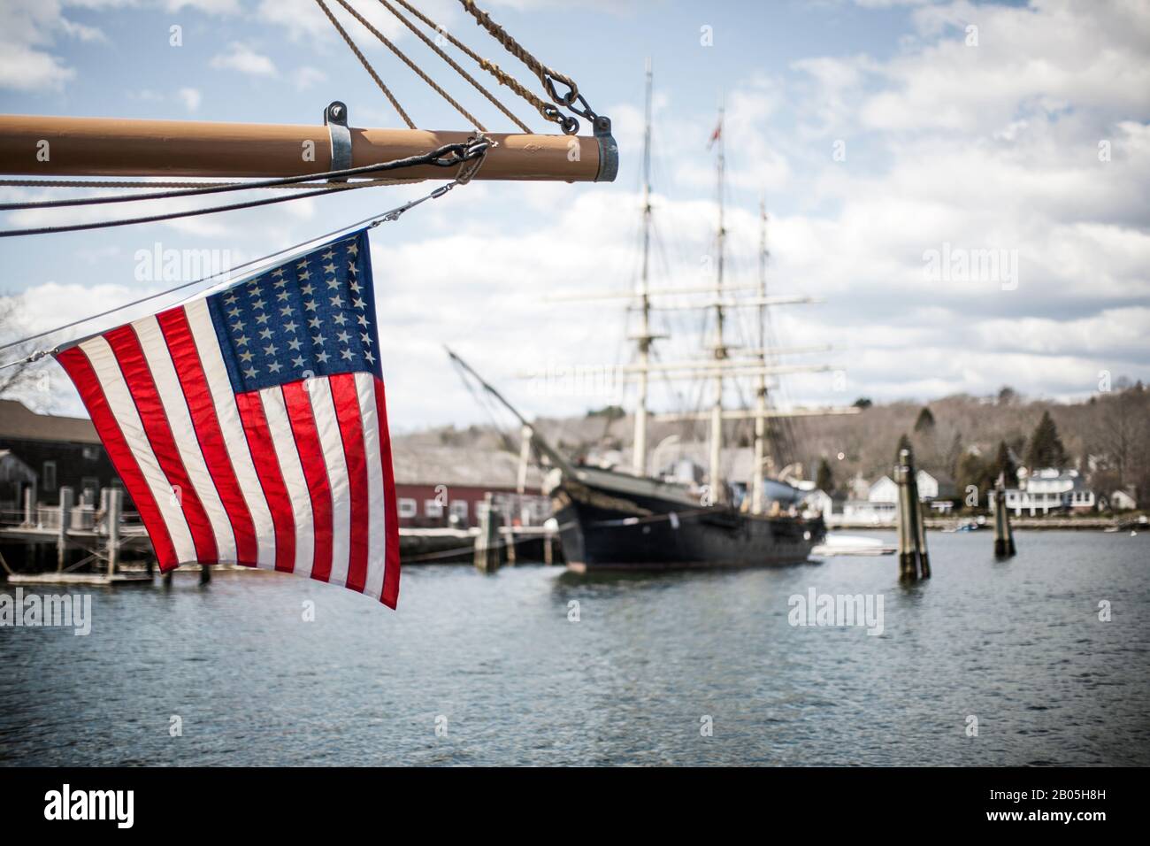 American flag flying at harbor Stock Photo - Alamy