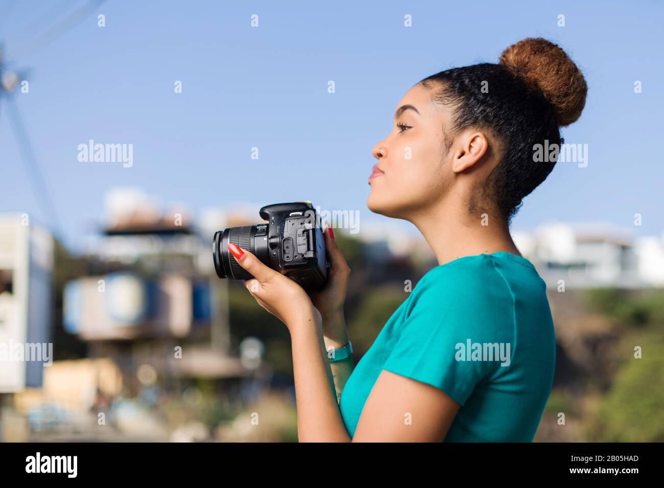 African American woman photographer taking outdoor photos - Black ...