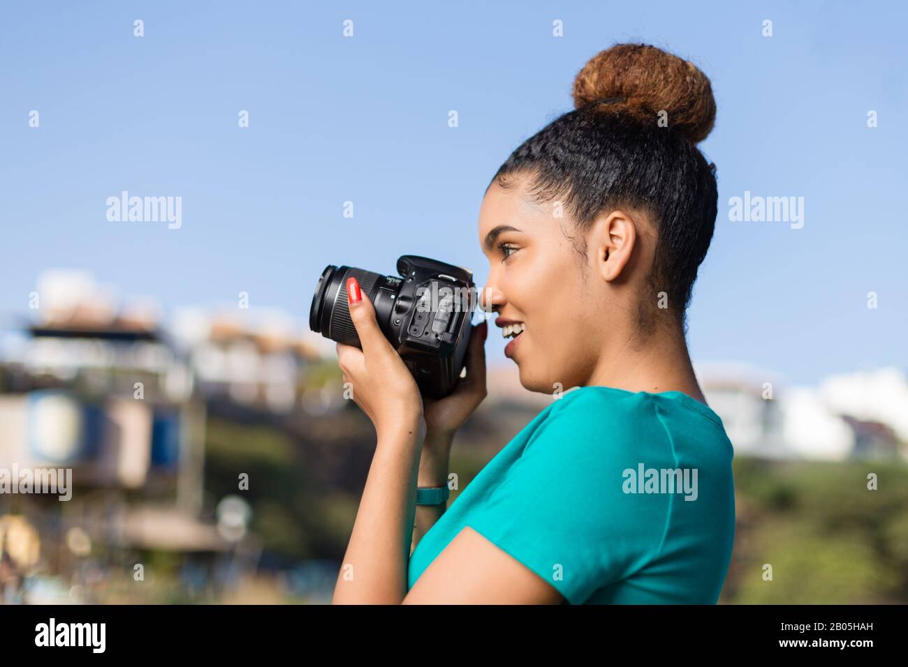 African American woman photographer taking outdoor photos - Black ...