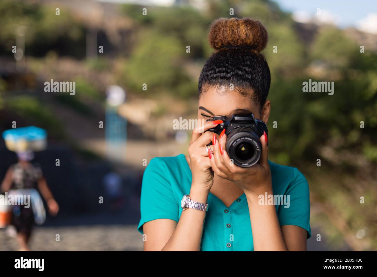 African American woman photographer taking outdoor photos - Black ...