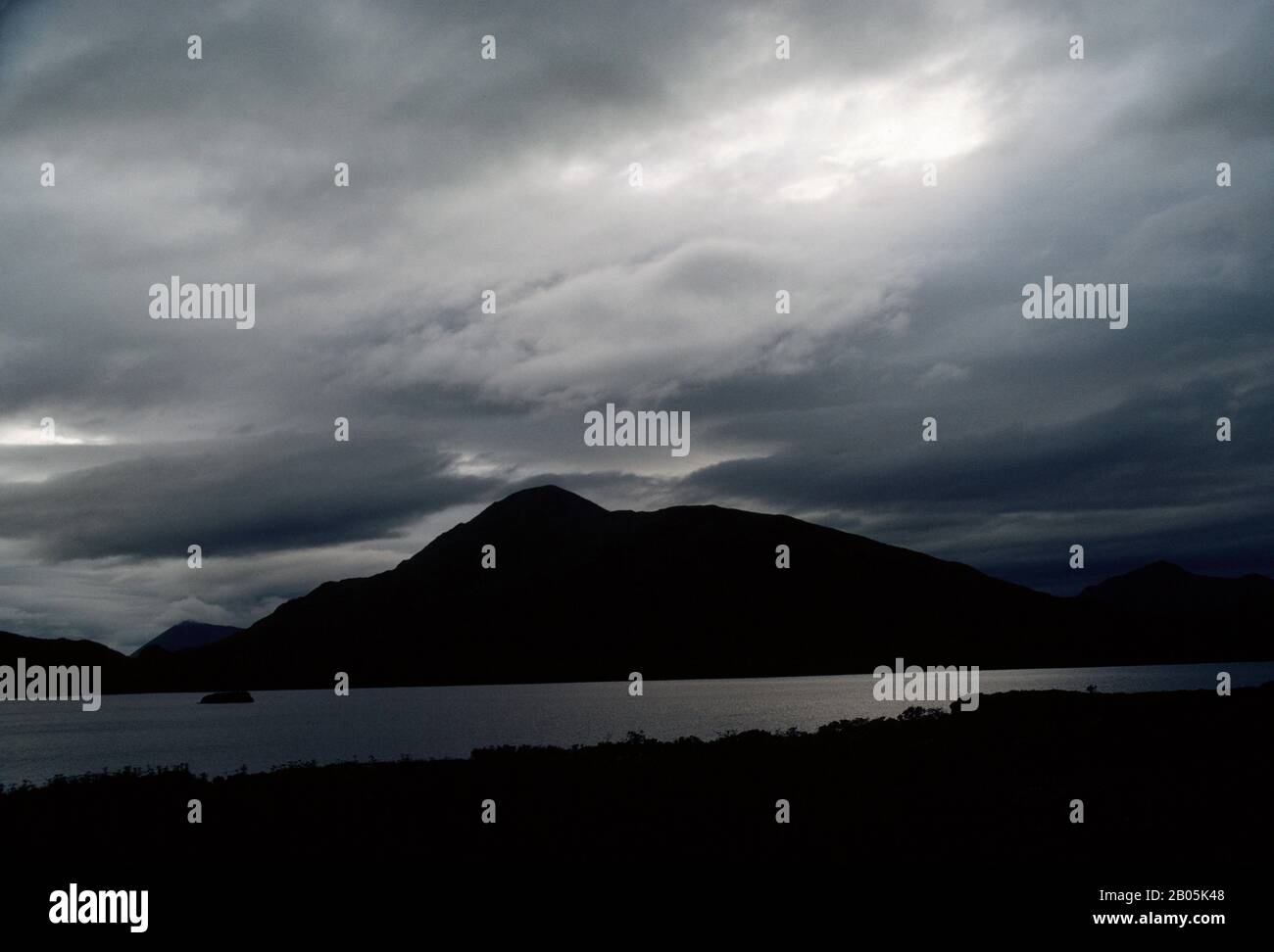 USA, ALASKA, KODIAK ISLAND DARK STRATUS CLOUDS OVER FRAZER LAKE Stock ...