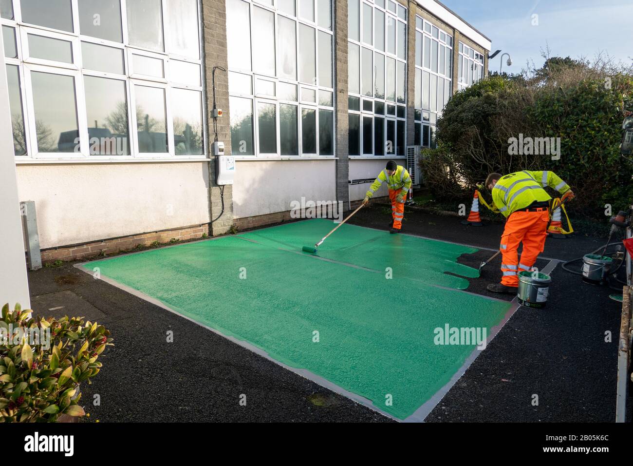 Electric Vehicle Bays being marked out Stock Photo - Alamy