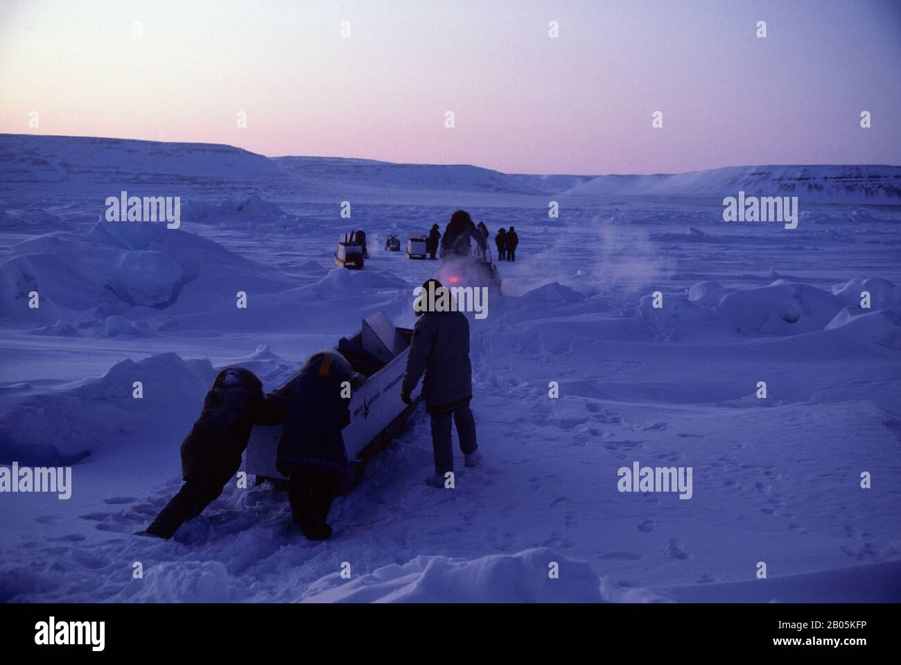 CANADA, NUNAVUT, FROZEN BARROW STRAIT, TOURISTS ON SKIDOO EXPEDITION ...