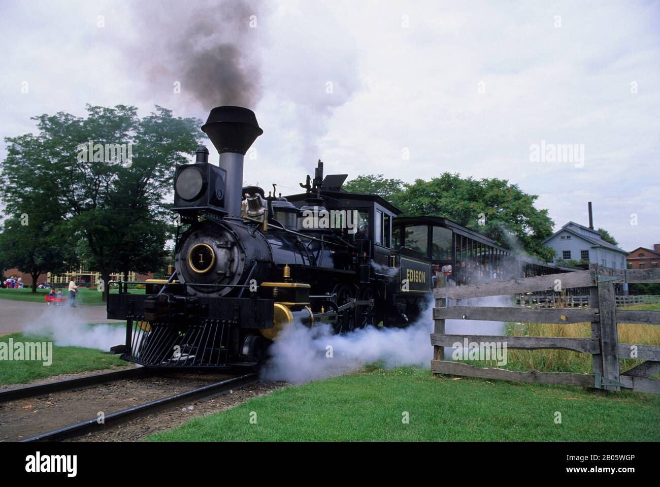 USA, MICHIGAN, DETROIT, GREENFIELD VILLAGE, TOURISTS RIDING STEAM TRAIN ...
