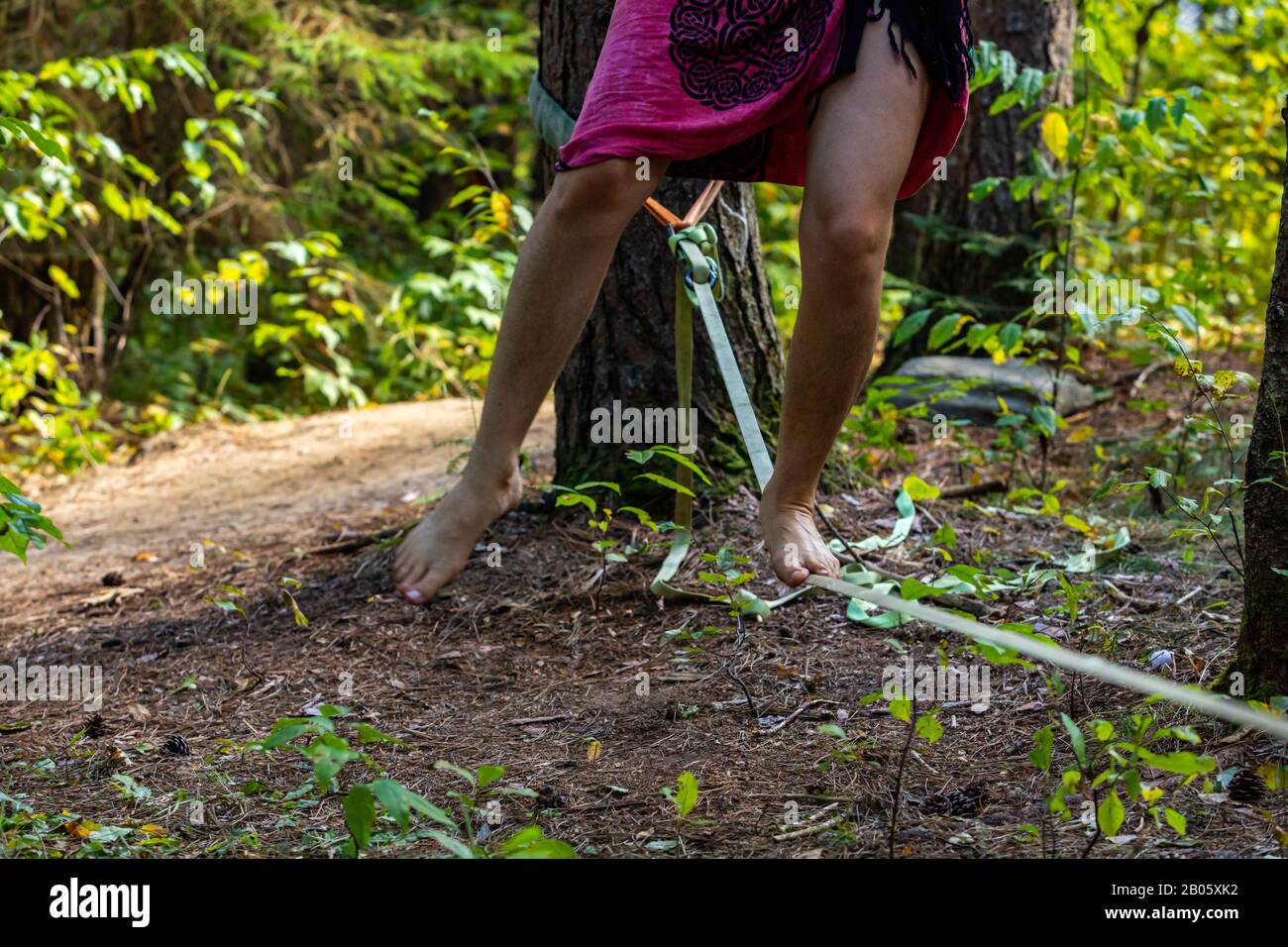 A close up shot on the legs of a woman wearing traditional clothes ...