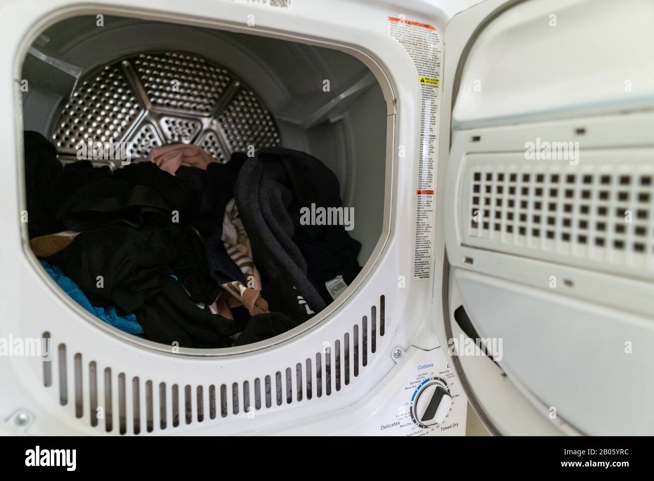Dryer of a laundry machine, open door Stock Photo - Alamy