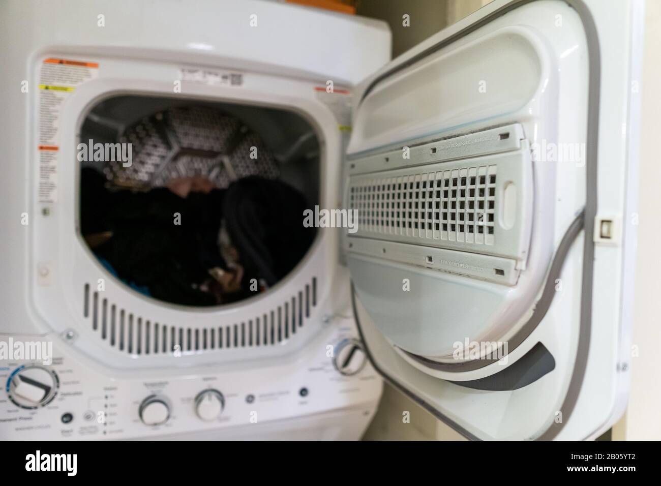 Dryer of a laundry machine, open door Stock Photo - Alamy