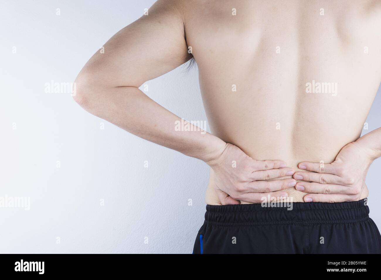 Closeup man suffering from lower back pain. Health care and medical ...