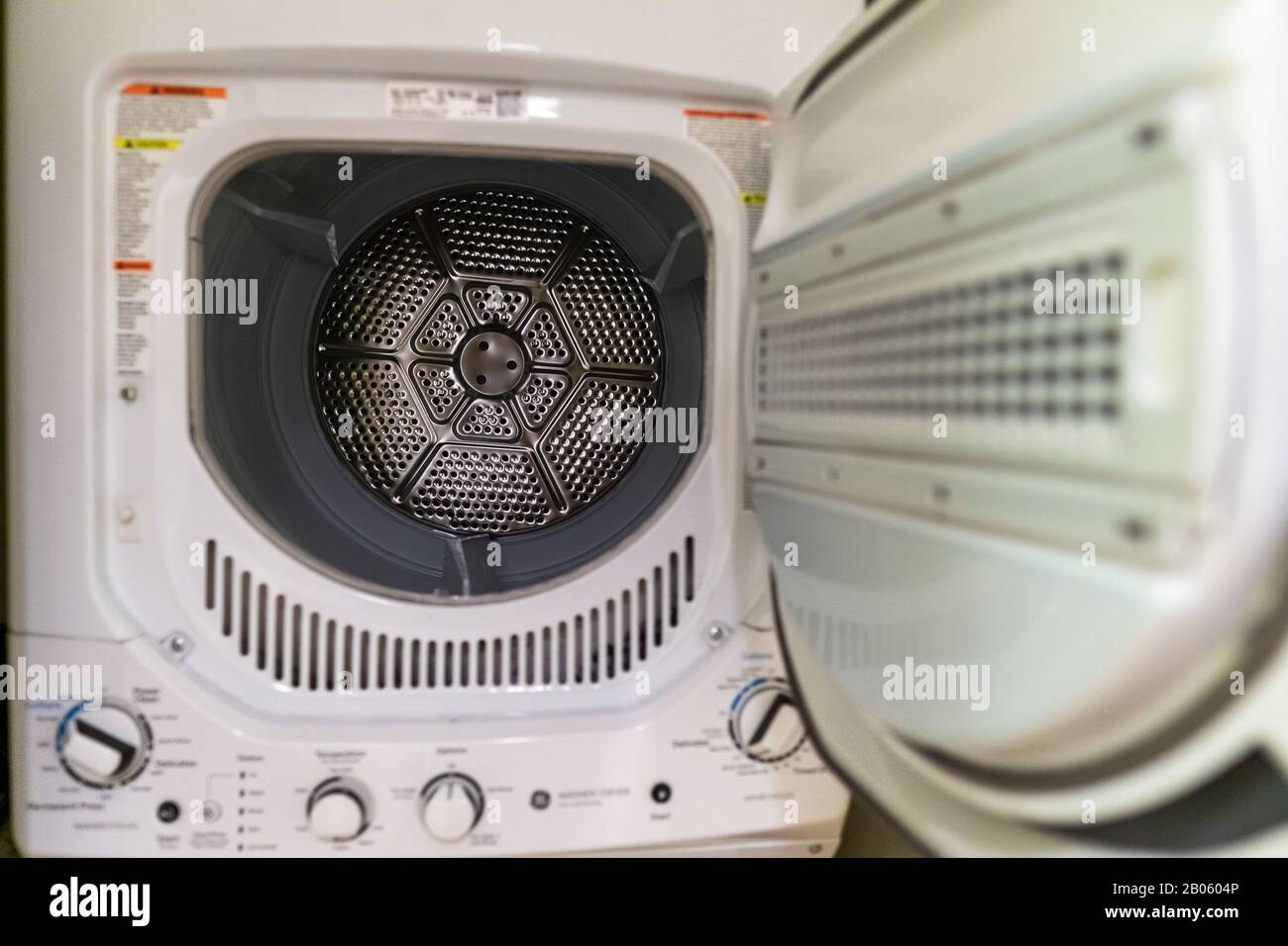 Dryer of a laundry machine, open door Stock Photo - Alamy