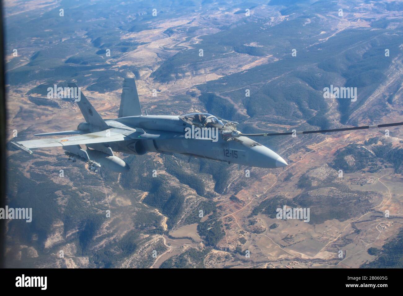 A Spanish Air Force F-18 Hornet with the 11th Wing receives fuel from a ...