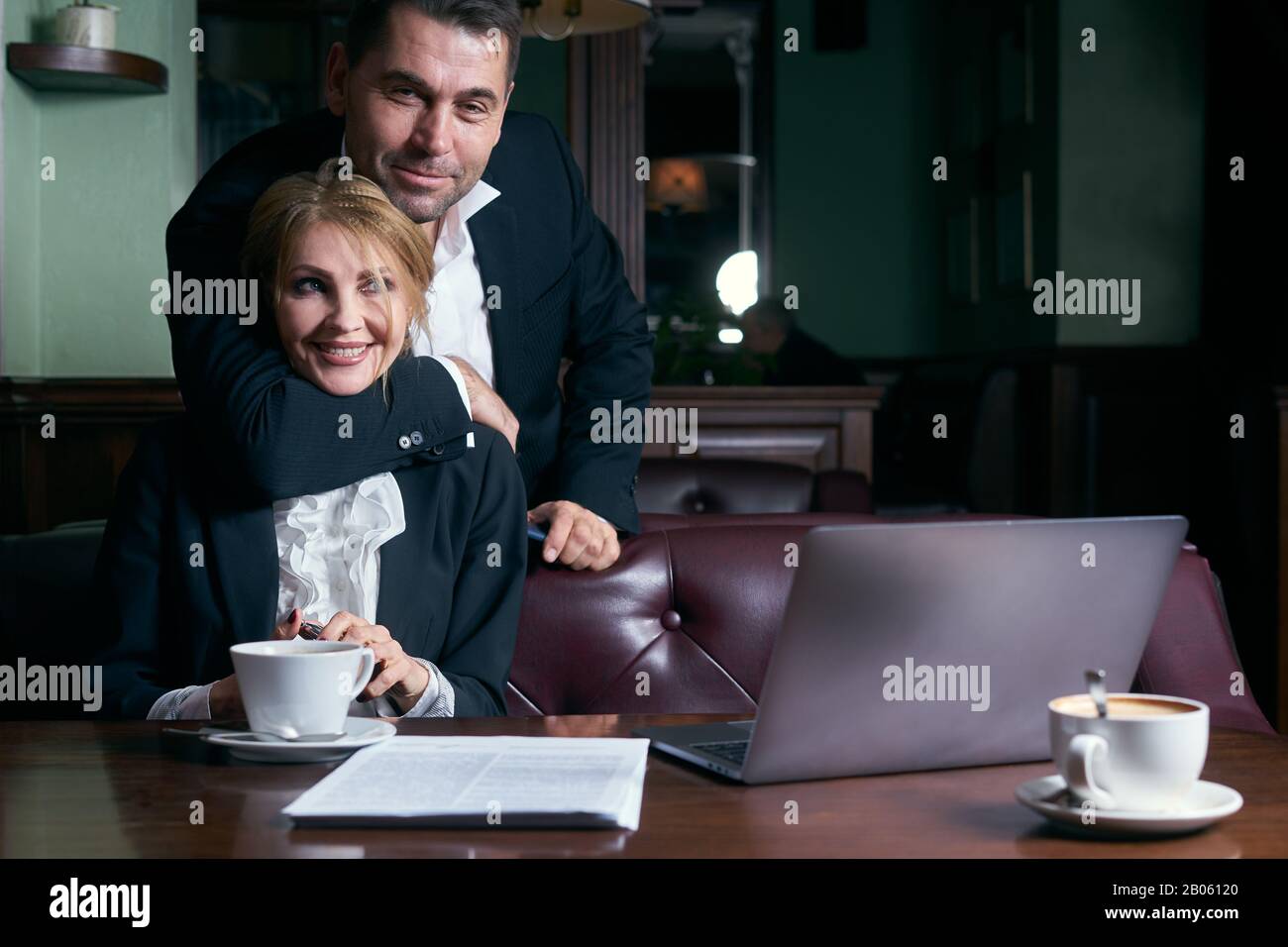 Business people talking over coffee in a cafe Stock Photo - Alamy