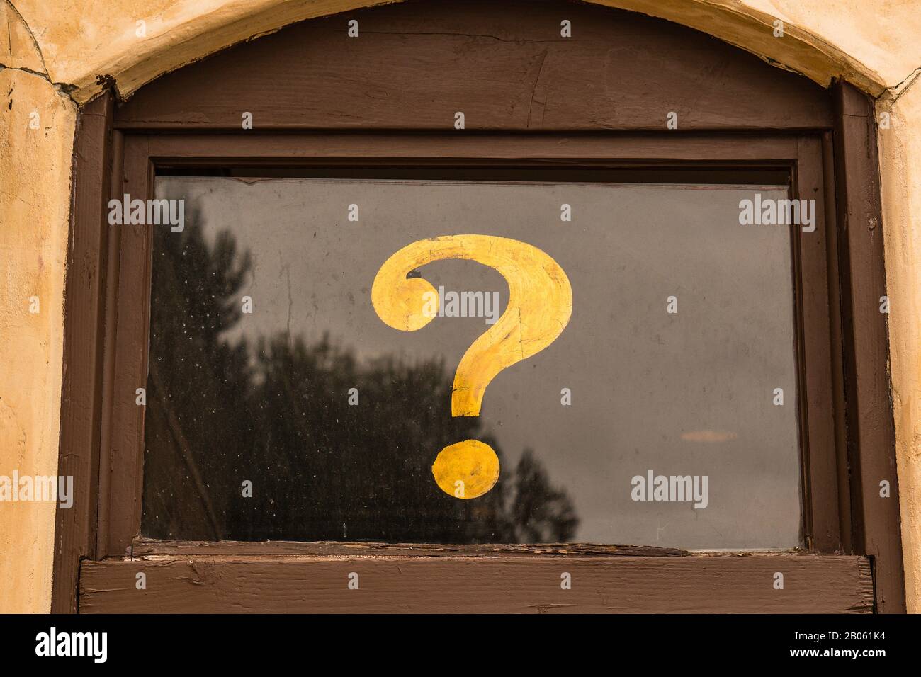 Yellow Gold Question Mark Sign on Old Window in Ghost Town Stock Photo ...