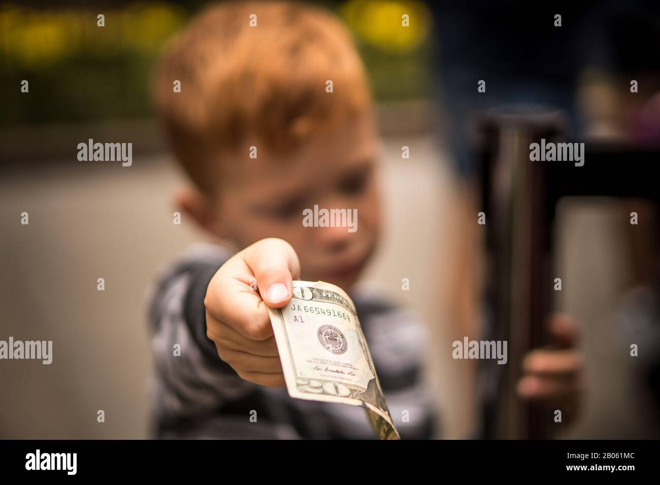 Young Hand Giving Money away $20 Bill American Money Stock Photo - Alamy