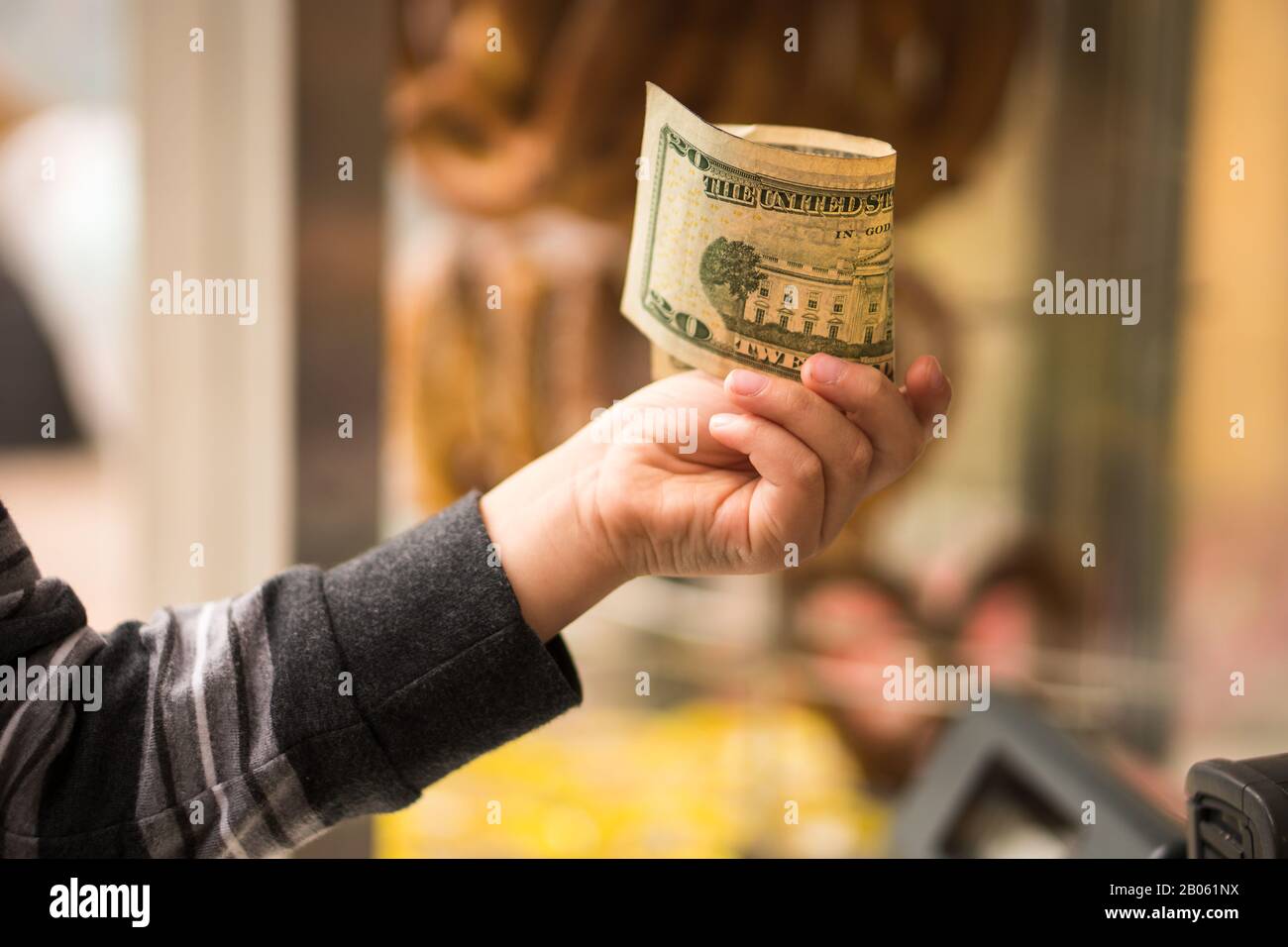 Young Hand Giving Money away $20 Bill American Money Stock Photo - Alamy